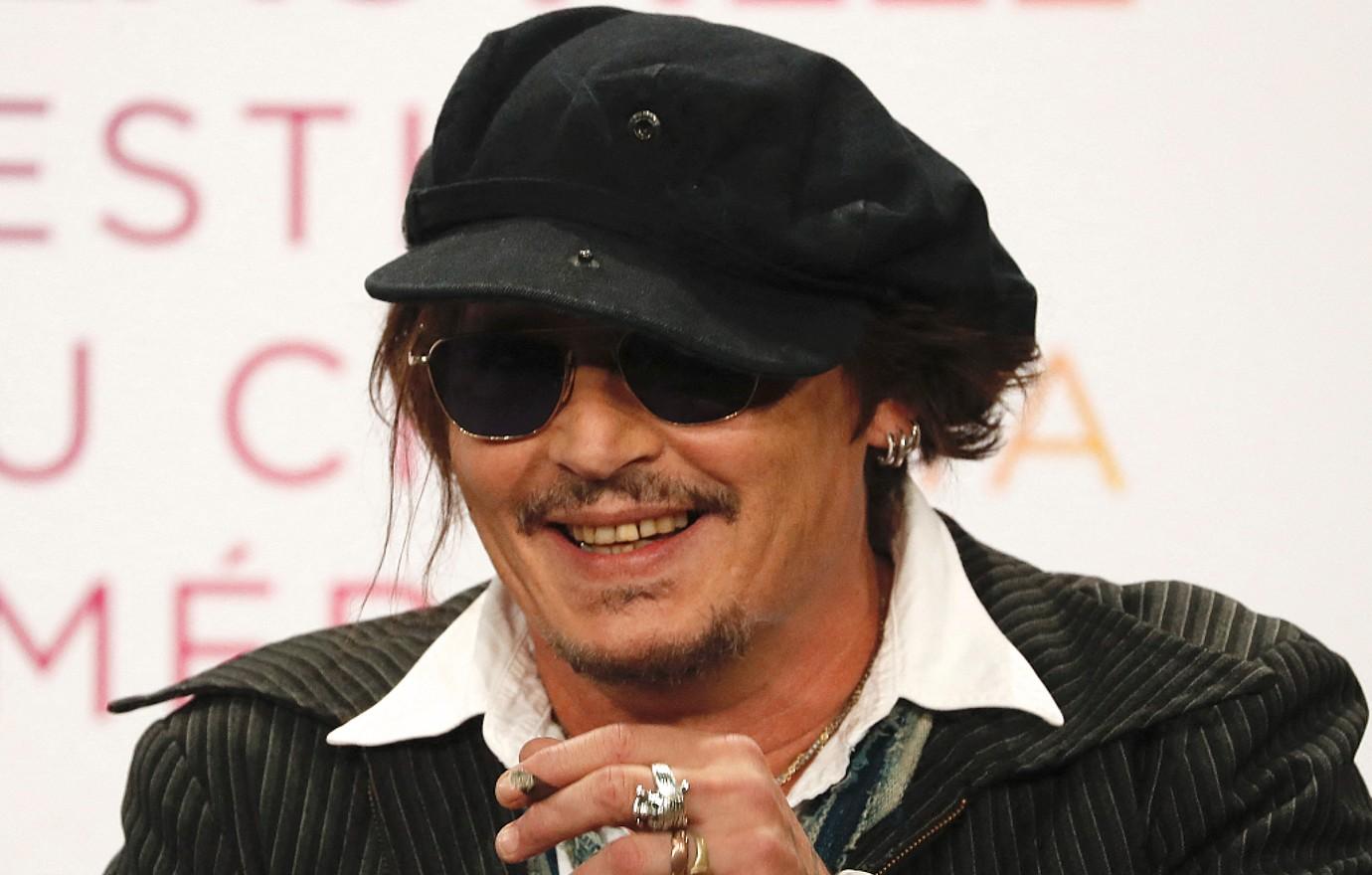 Johnny Depp Shows Off New Teeth In New Video