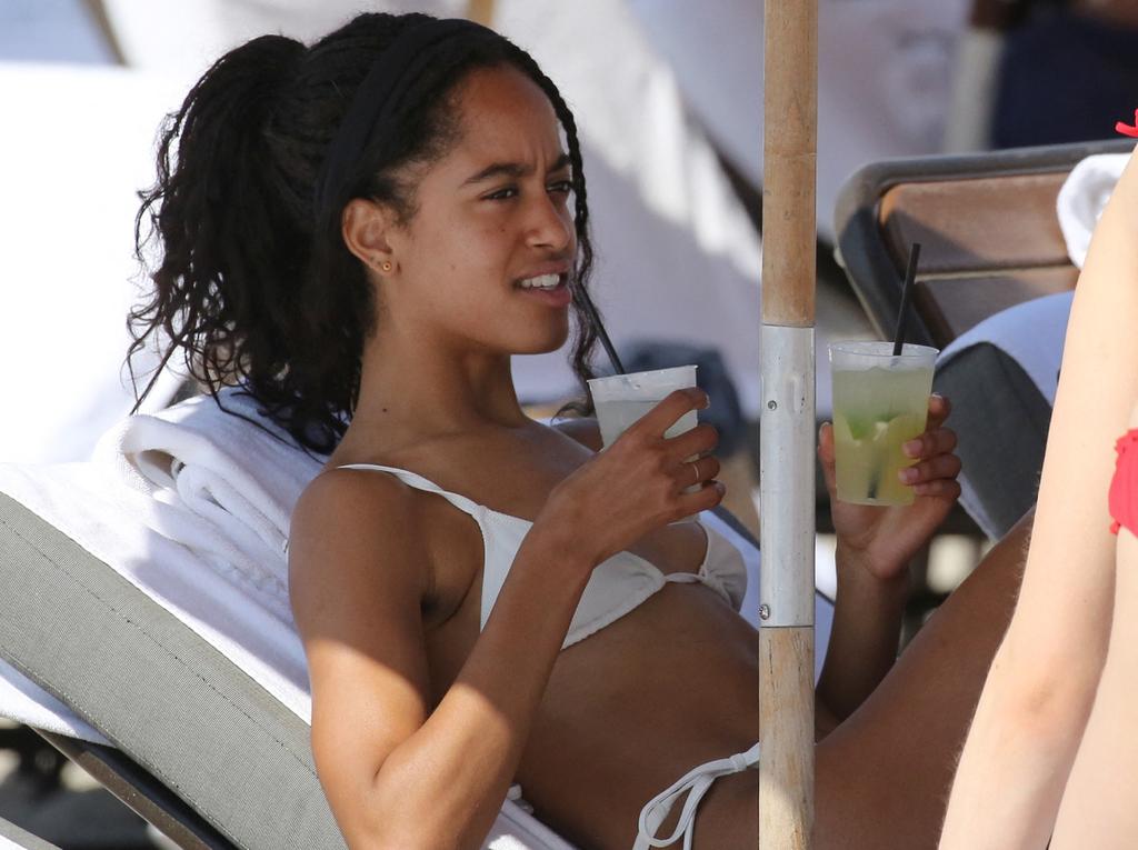 Malia & Sasha Obama Hang With Emma Stone At 'SNL' After-Party