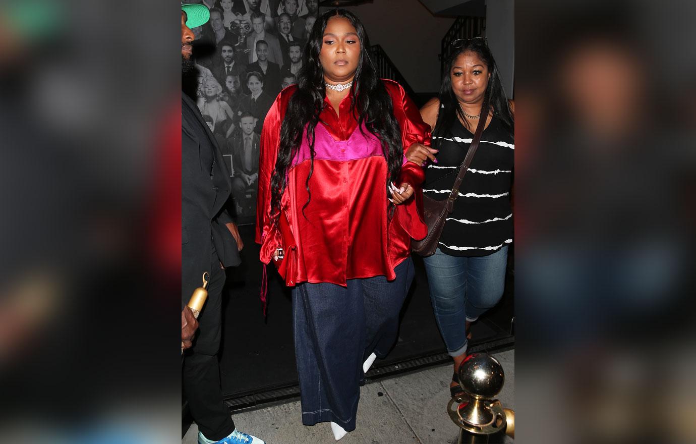 Lizzo Wears Vibrant Red-And-Pink Silk Shirt To Catch L.A.