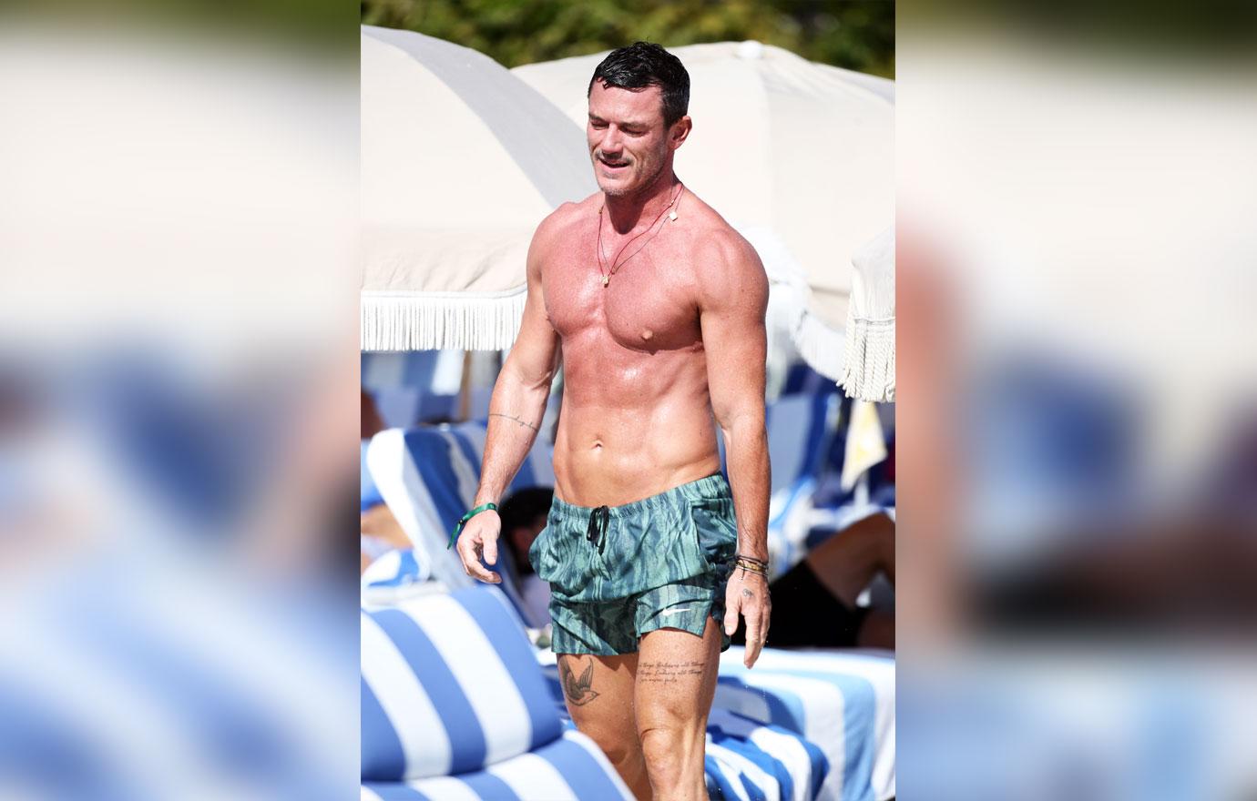 Luke Evans Flaunts Shredded Abs On Beach In Miami: Pics