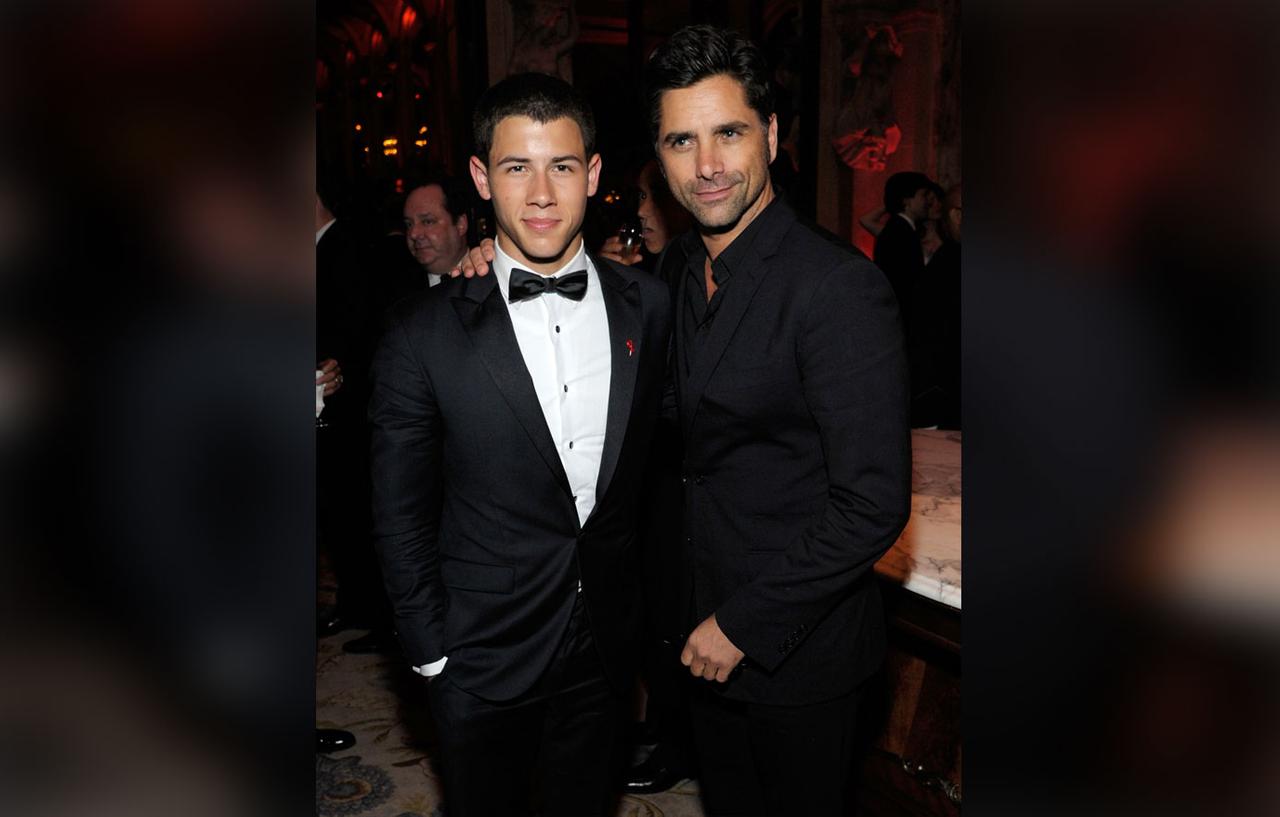 John Stamos Gets Tattoo Of Nick Jonas' Face During Hilarious Prank War