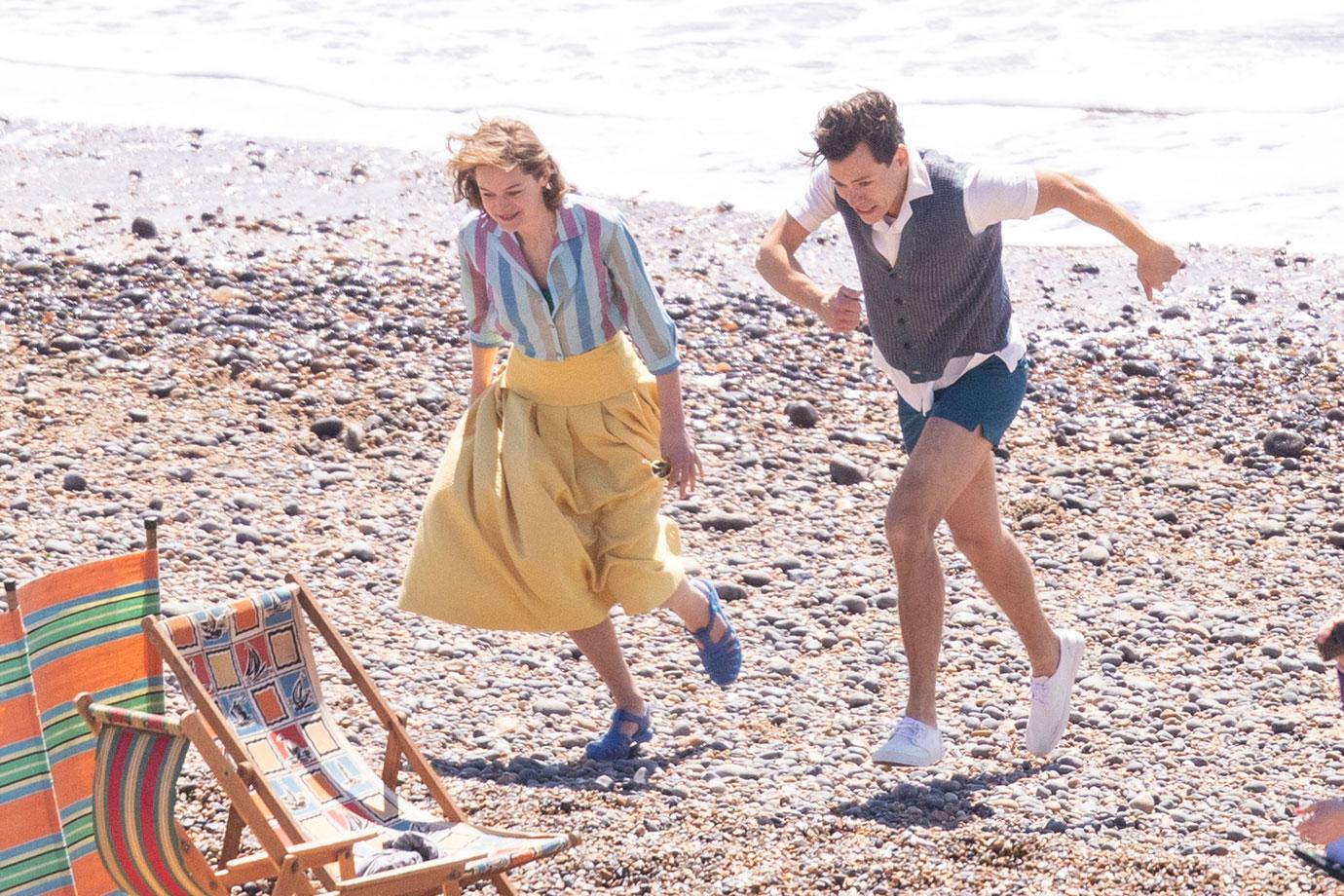 Harry Styles, Emma Corrin Frolic On Beach For 'My Policeman': Photos