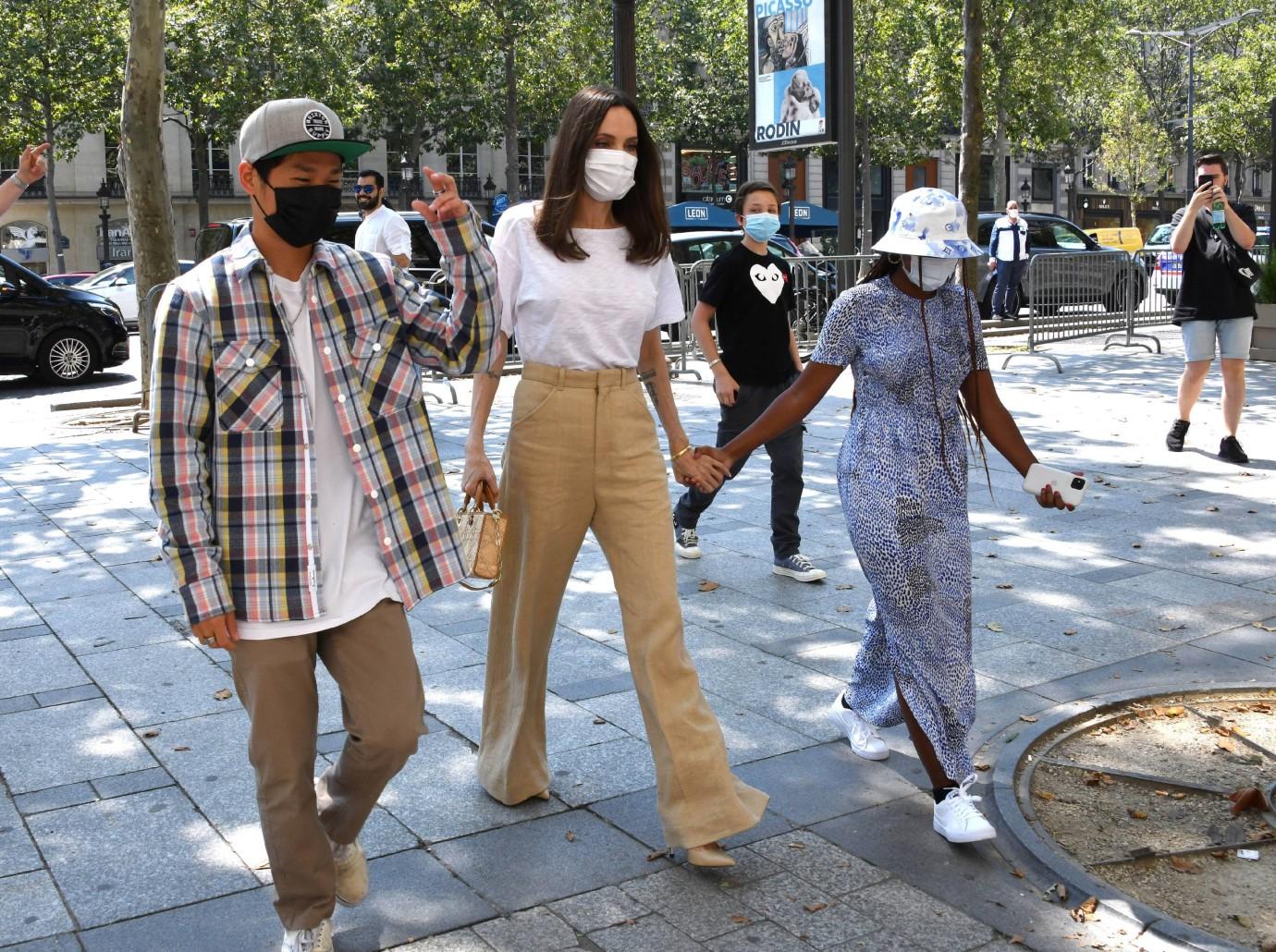 Pax Jolie-Pitt Takes His Dog For A Walk