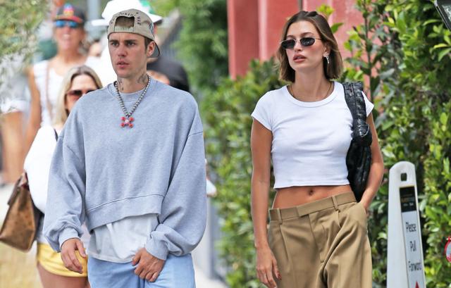 Justin & Hailey Bieber Pack On The PDA At Coachella: Watch