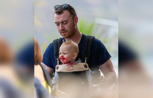 Sam Smith Babysits His Friend’s Baby & Spills Ice Cream All Over His Face