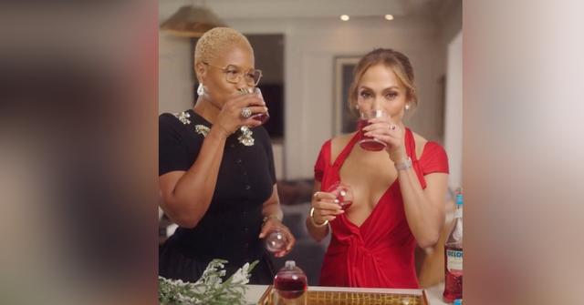 Jennifer Lopez Wears Low-Cut Red Dress To Make Holiday Drinks: Photos