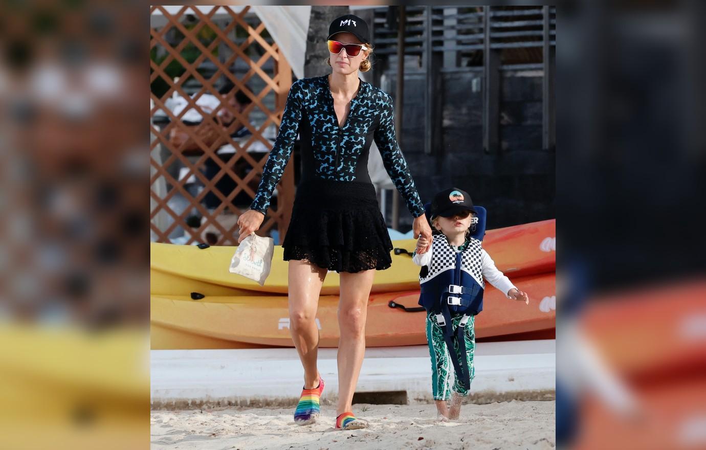 Paris Hilton Takes A Tumble During Kayak Ride With Son Phoenix: Photos