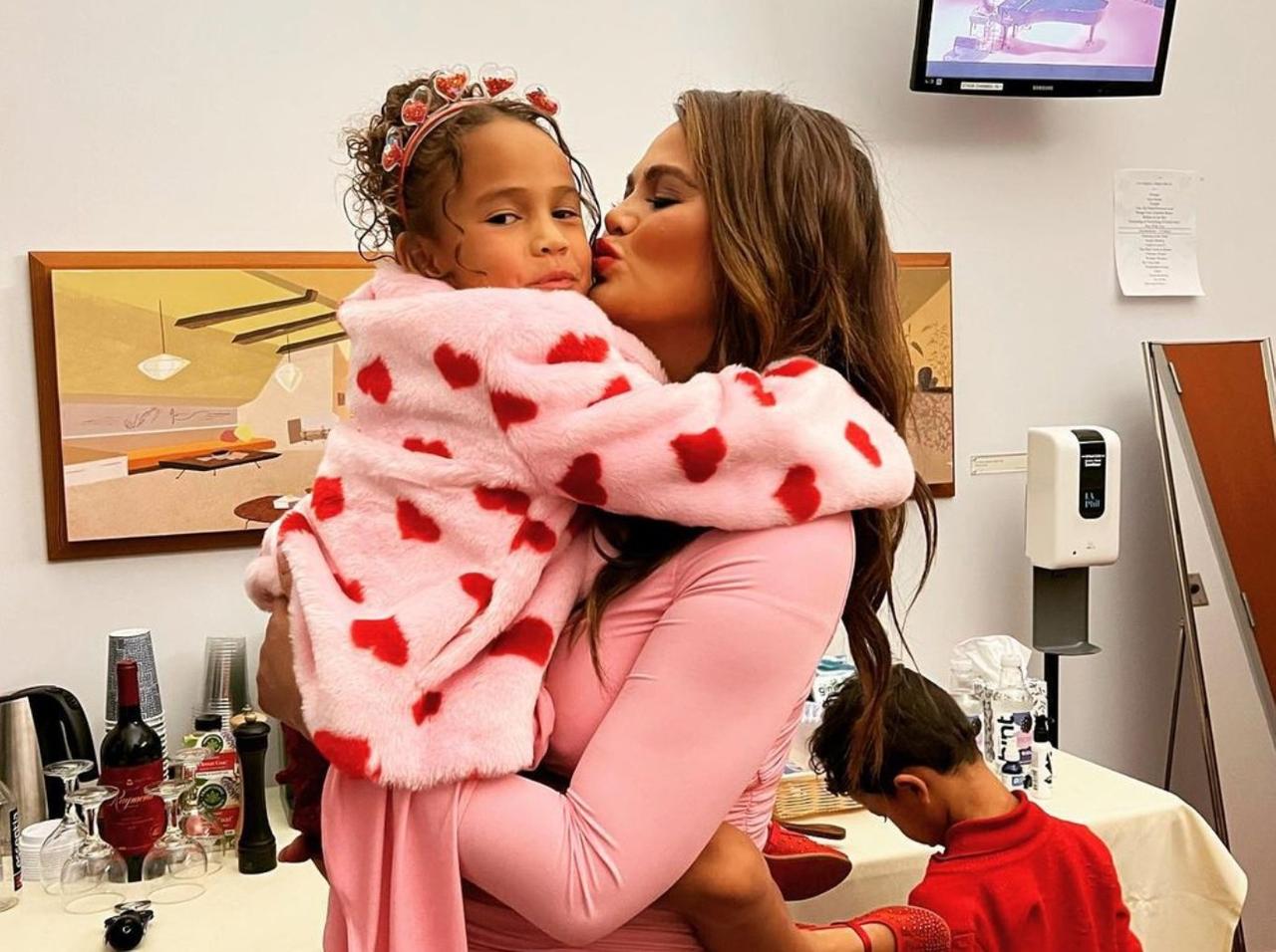 Chrissy Teigen & John Legend's Dog Cozies Up To Their Newborn: Photo