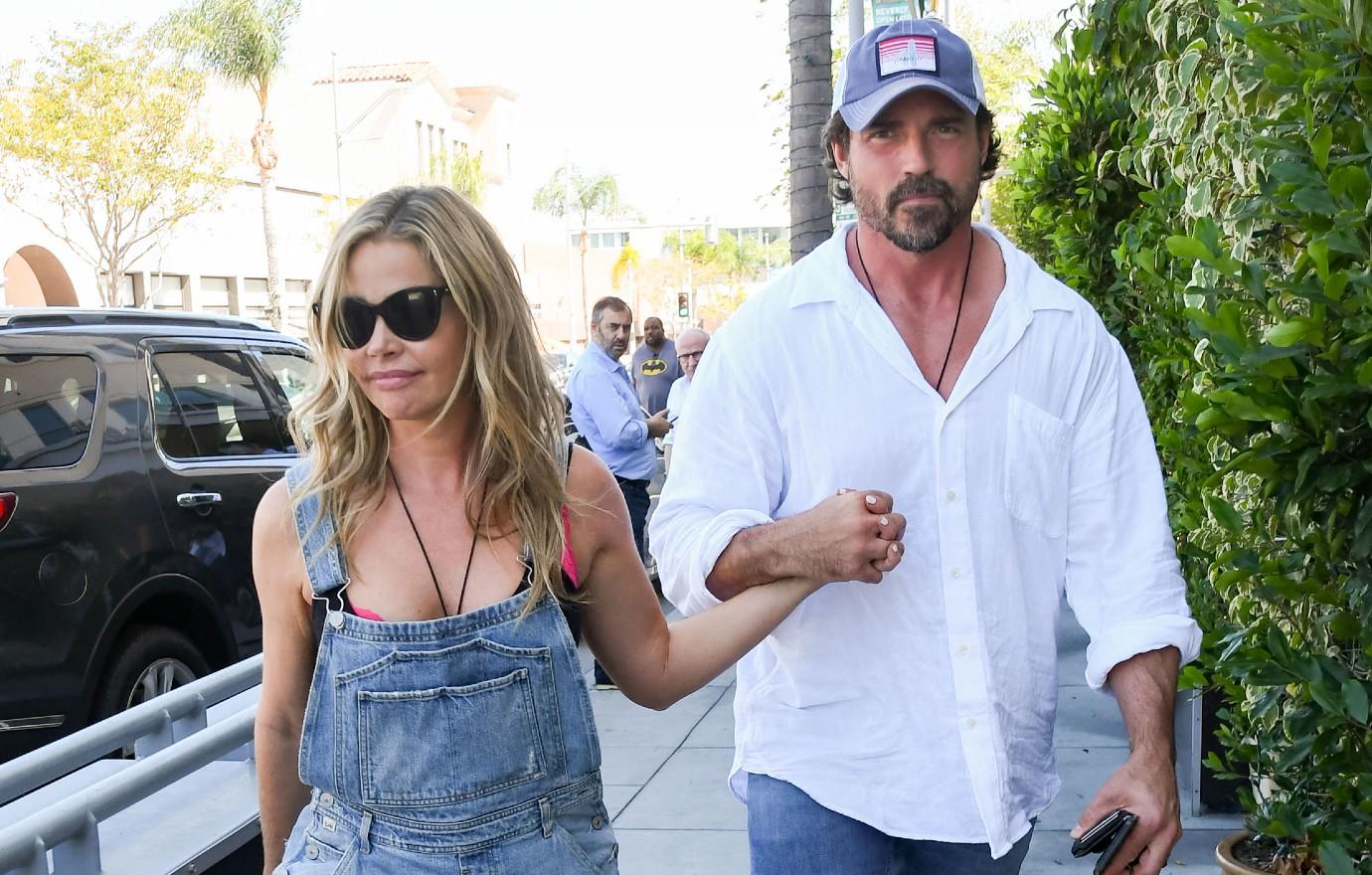 Denise Richards Shares Smooch With Hubby Aaron Phypers While Shopping