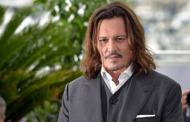 Johnny Depp All Smiles Alongside St. Vincent In London: Photo