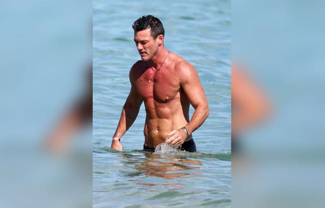 Luke Evans Flaunts Shredded Abs On Beach In Miami: Pics