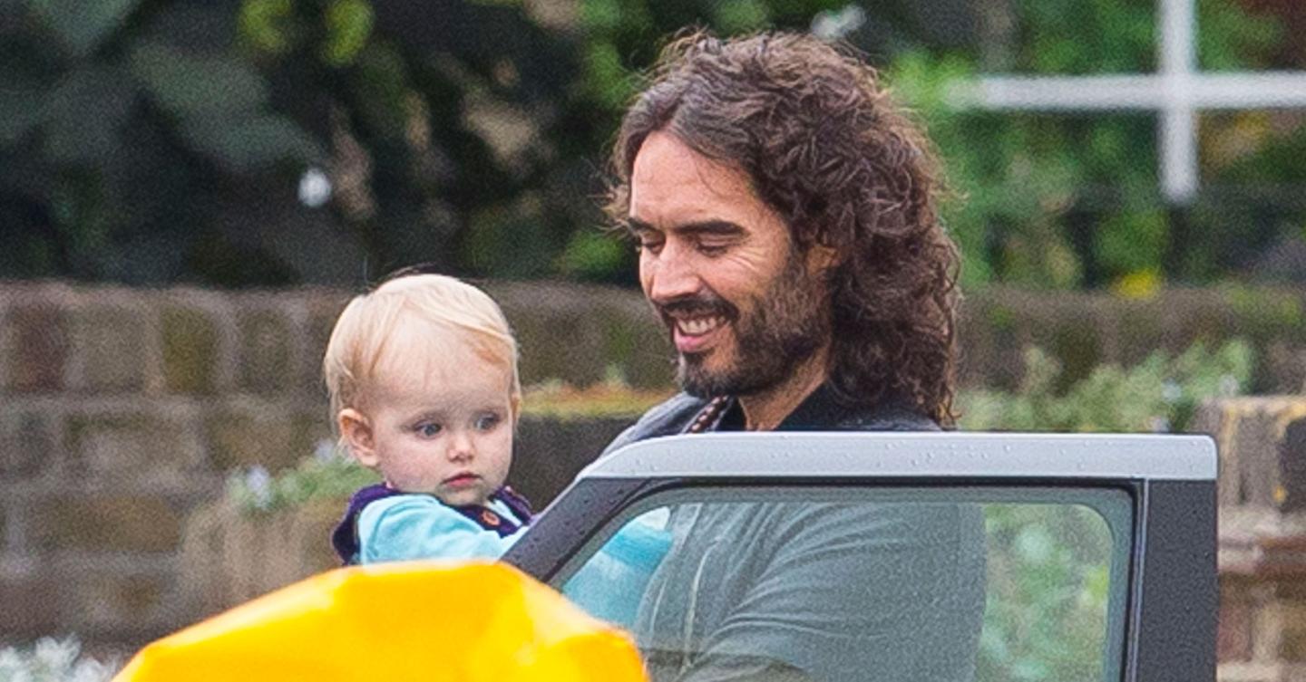 Russell Brand Cradles Precious Daughter During Stroll With Wife