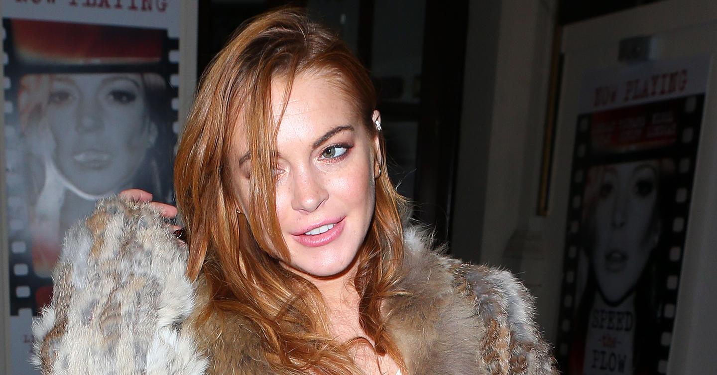 Lindsay Lohan Hides Under Fur Coat While Leaving London Night Club LouLou's