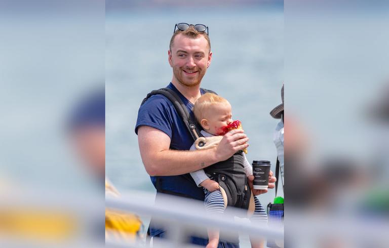 Sam Smith Babysits His Friend’s Baby & Spills Ice Cream All Over His Face