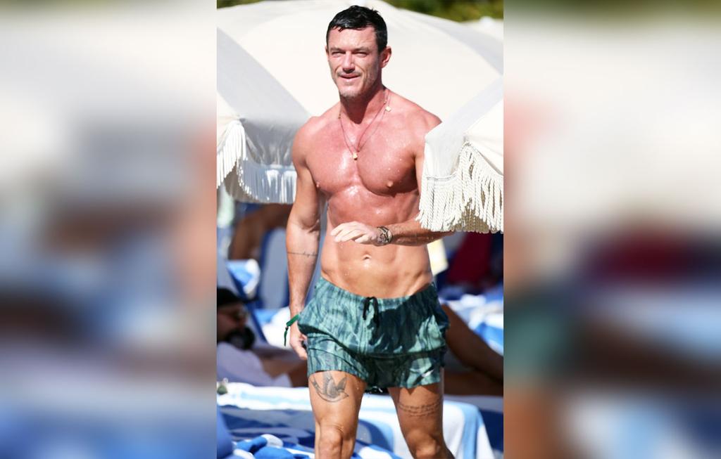 Luke Evans Flaunts Shredded Abs On Beach In Miami: Pics