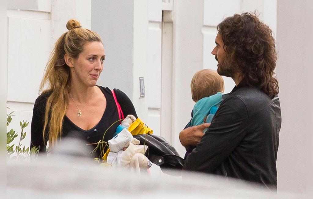 Russell Brand Cradles Precious Daughter During Stroll With Wife