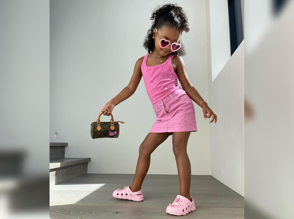True Thompson Models Louis Vuitton Bag & All-Pink Outfit